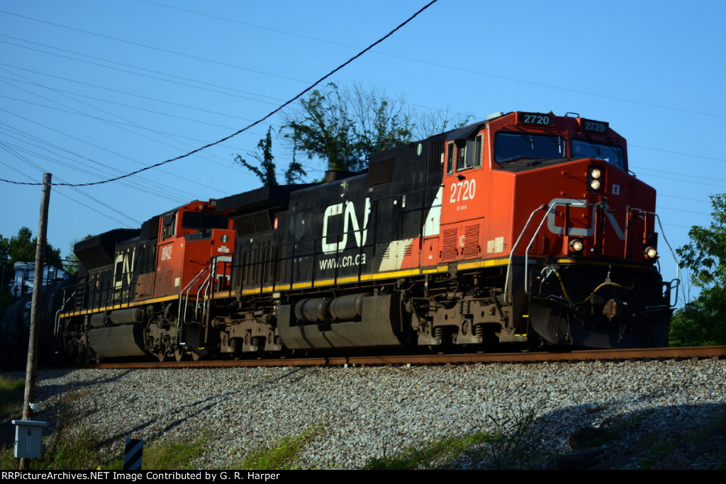 CN 2720 leads sulphur train K898 late in the day through Reusens